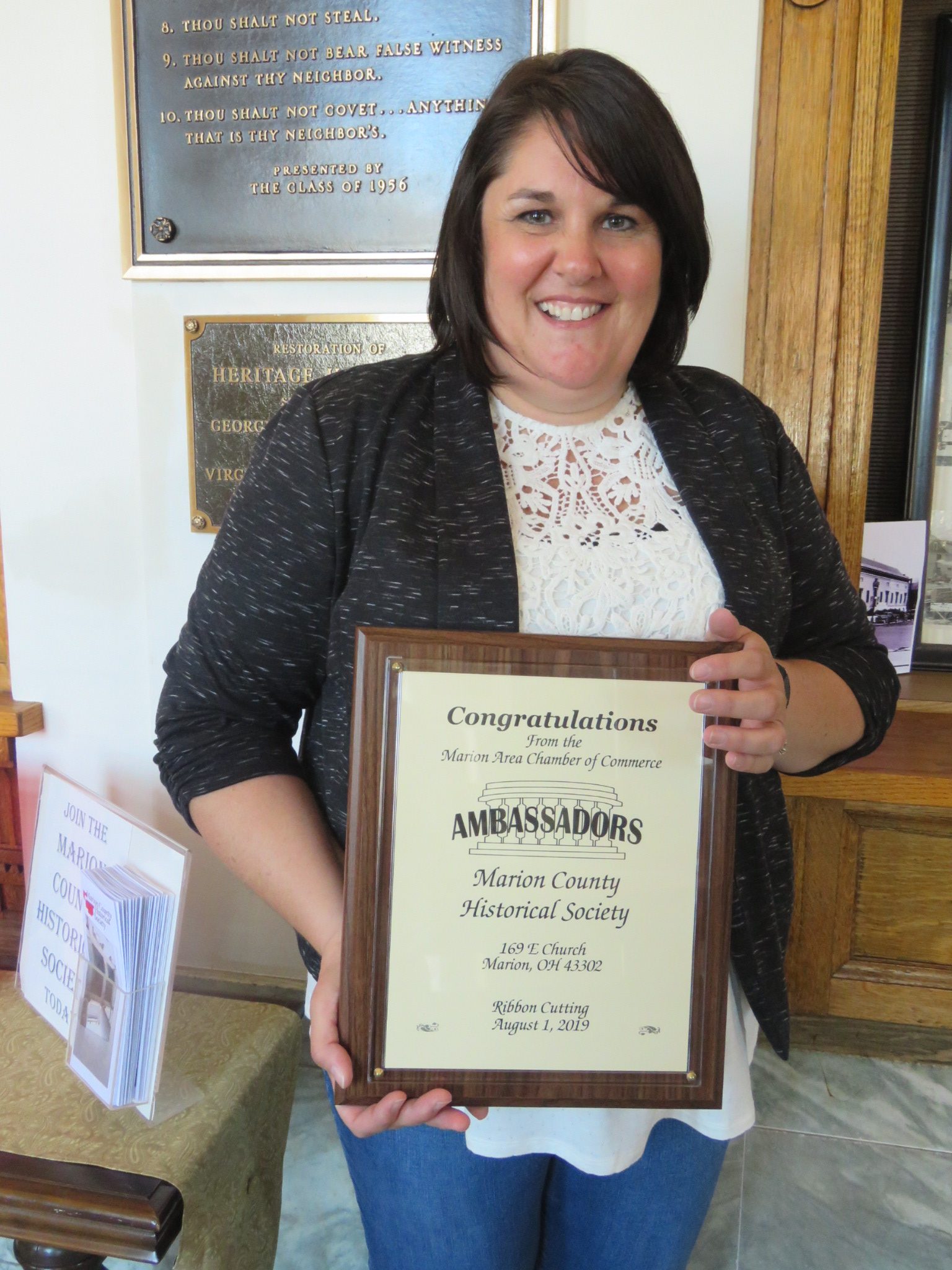Brandi Wilson accepting a plaque from the Marion Area Chamber of ...